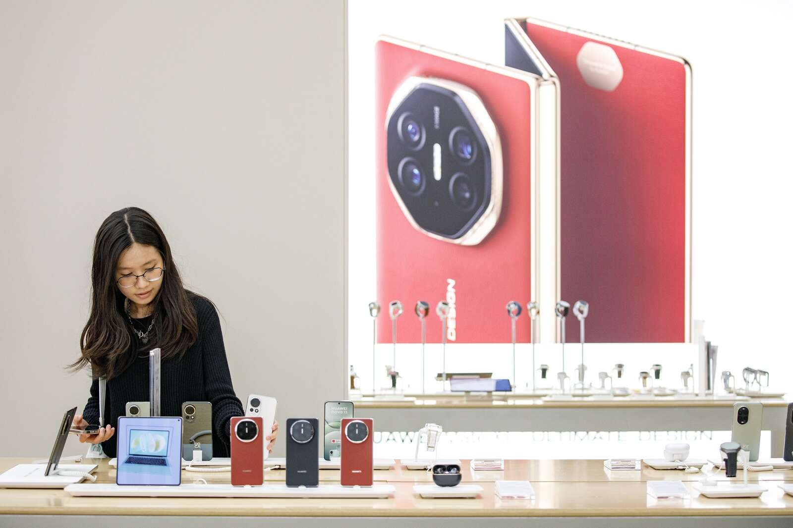 Huawei posts surprise loss after US sanctions spur tech research ...