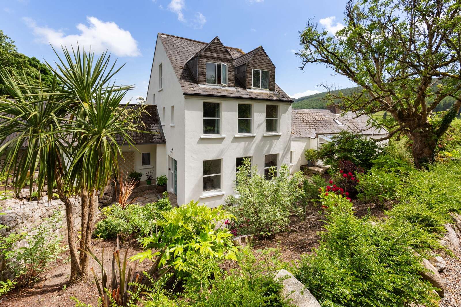 Three-storey home and former woodland arts centre offer ‘piece of the ...